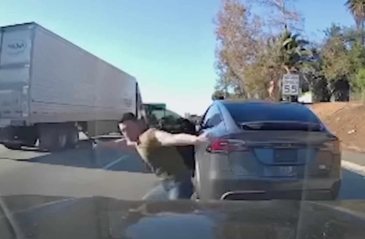 Wild Moment Enraged Tesla Driver Smashes Cars With Metal Pipe